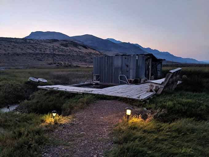 Solar lights guiding the way to warm water at dusk, proof that good things really do come to those who drive very, very far.