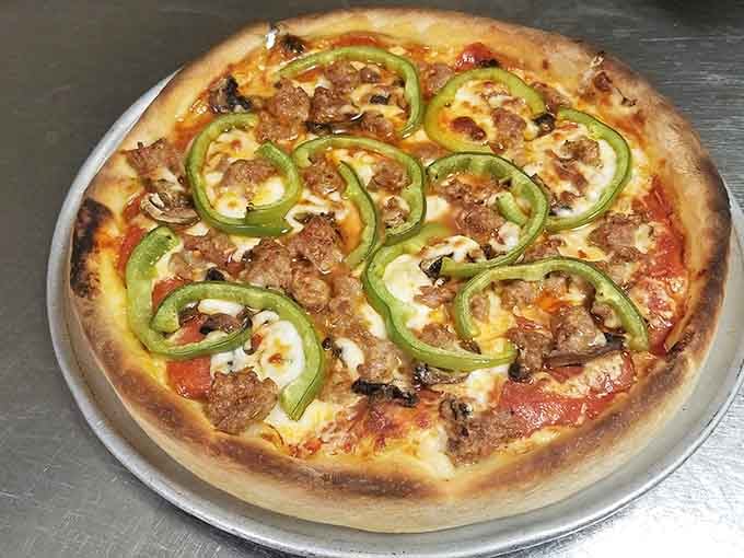 That golden crust with sausage and green peppers on top is the kind of pizza that ends debates.