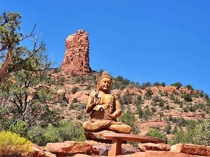 This golden Buddha statue sits in eternal meditation, completely unfazed by the spectacular scenery behind it.
