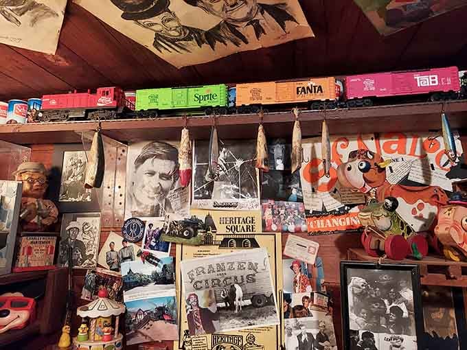 A Coca-Cola train running above circus posters and old photographs, proof that this place never runs out of surprises.