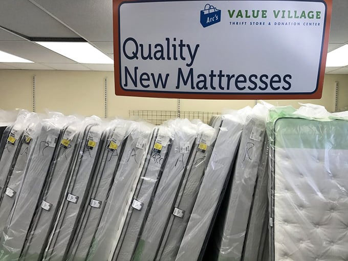 Yes, that's a section of brand-new mattresses inside a thrift store, and yes, your back just got very interested.