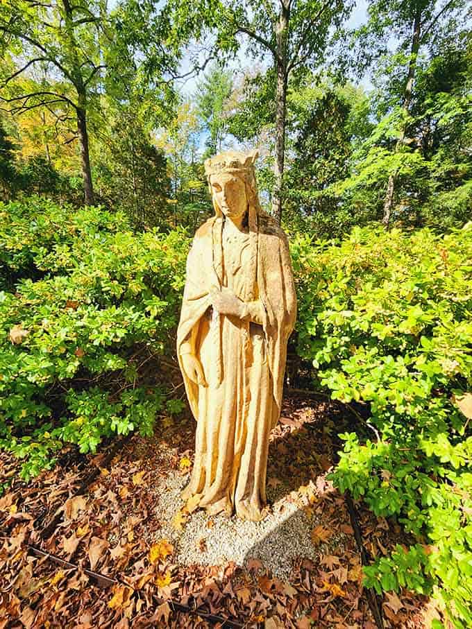 A stone guardian keeping quiet watch over the garden, looking considerably more patient than anyone waiting in a theme park line.
