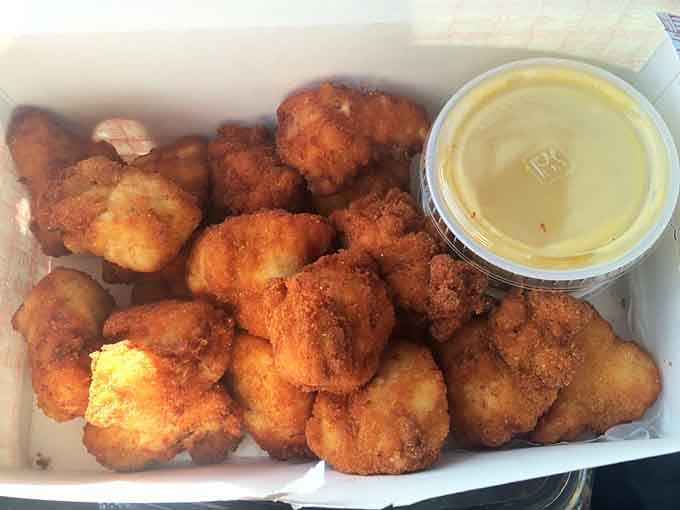Juicy, golden chicken bites with honey mustard sauce, the kind of combination that makes you forget everything else on the menu exists.