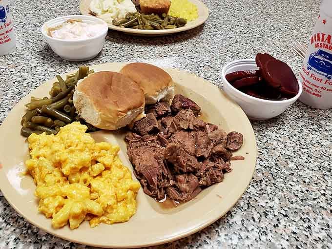 Tender pulled meat, mac and cheese, green beans, and cornbread &mdash; a Southern plate that means business.