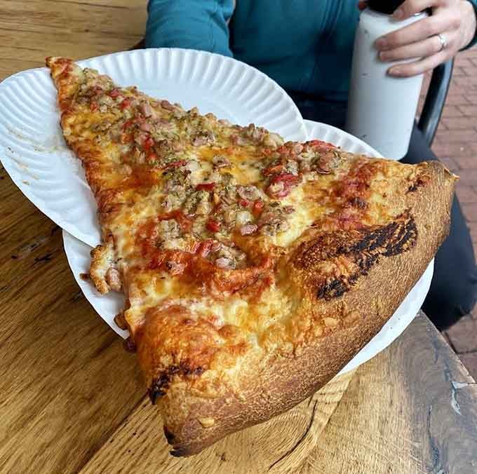 That golden crust and generous sausage topping situation is what pizza dreams are made of, folks.