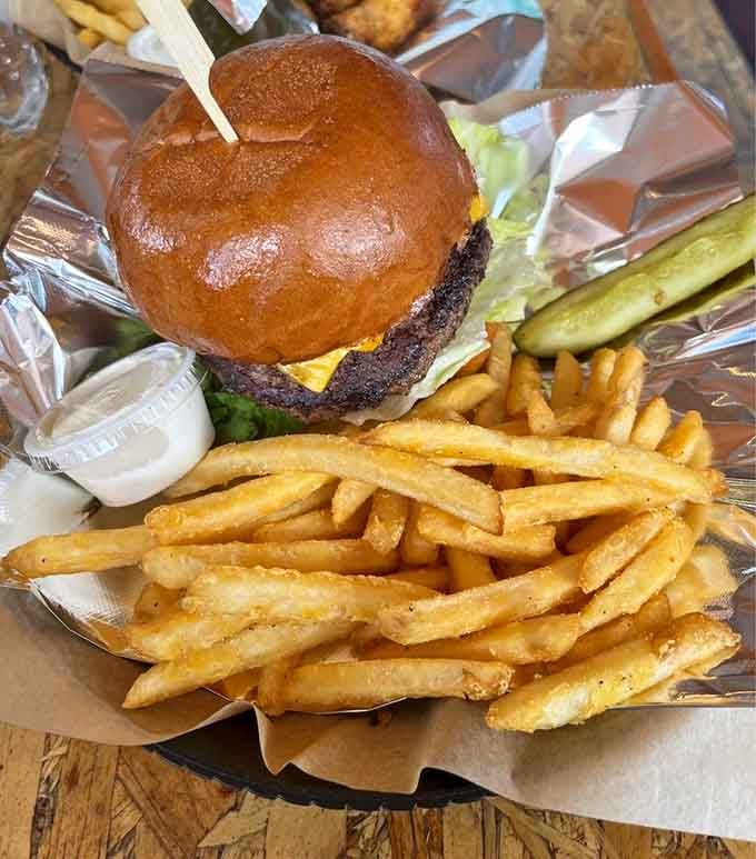 Golden fries piled next to a perfectly built cheeseburger. Sometimes the classics earn their reputation one satisfying, crunchy bite at a time.