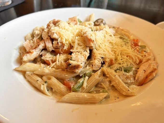 Penne pasta, grilled chicken, and a creamy sauce that coats every single bite. Comfort food dressed up nicely.