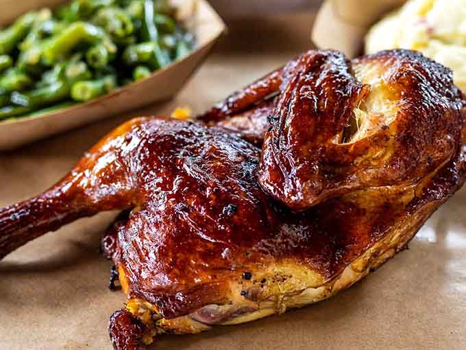 Smoked chicken so deeply bronzed and glossy, it looks like it just won a beauty pageant it didn't even enter.