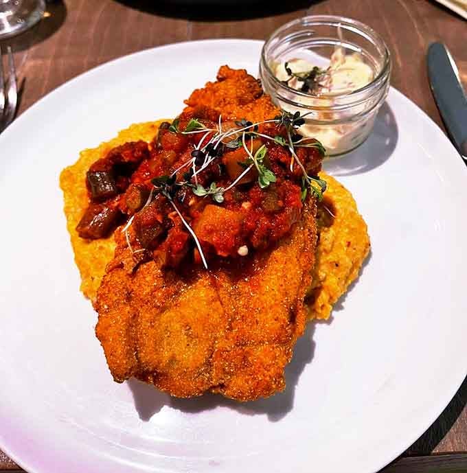 That cornmeal crust on the catfish is doing extraordinary work. Topped with a rich sauce, it's comfort food wearing a tuxedo.