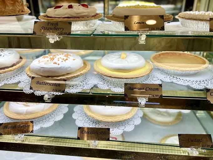 Butterscotch, banana cream, peanut butter, custard, fresh strawberry, all sitting there looking impossibly calm about being this good.