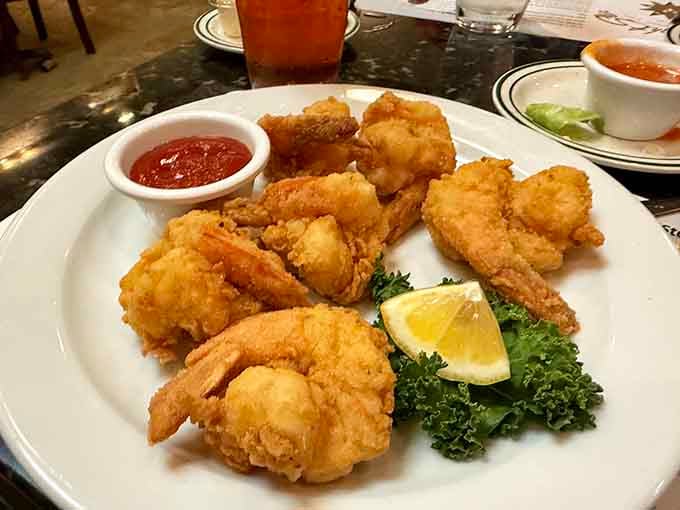 Crispy, golden fried shrimp with cocktail sauce, the kind of plate that makes you forget every other meal you've ever had.