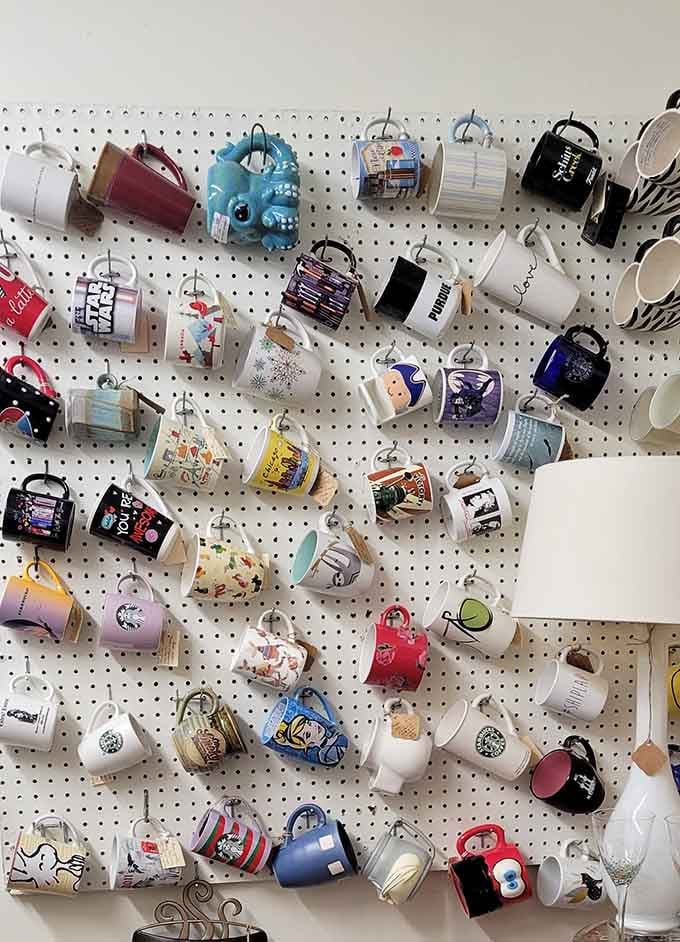 An entire wall of mugs featuring Star Wars, Purdue, and Schitt's Creek, because your morning coffee deserves better conversation.