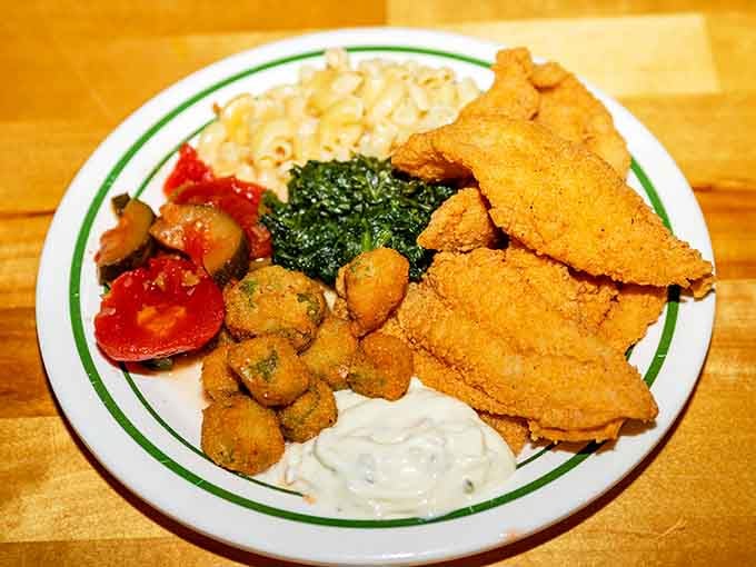 Fried fish, fried okra, mac and cheese, and greens, a plate that covers all the Southern food groups beautifully.