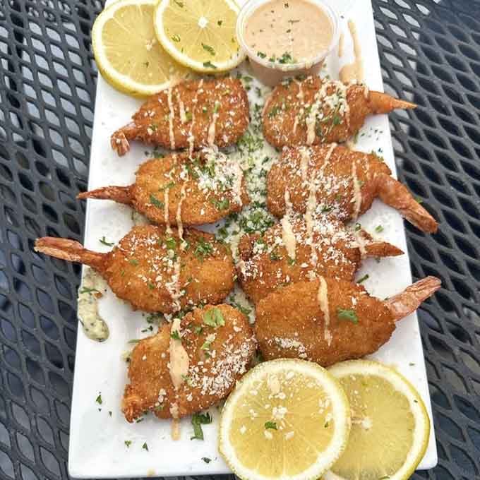 Breaded shrimp lined up like golden soldiers, ready to march straight into your heart and never leave it behind.