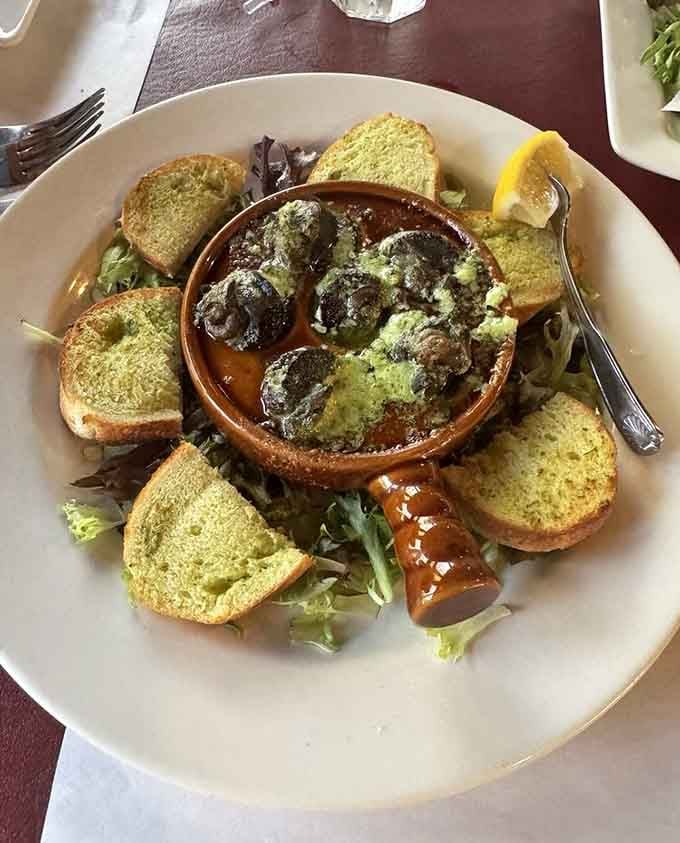 Escargot with garlic butter and toasted bread, proof that this little island restaurant has a few surprises up its sleeve.