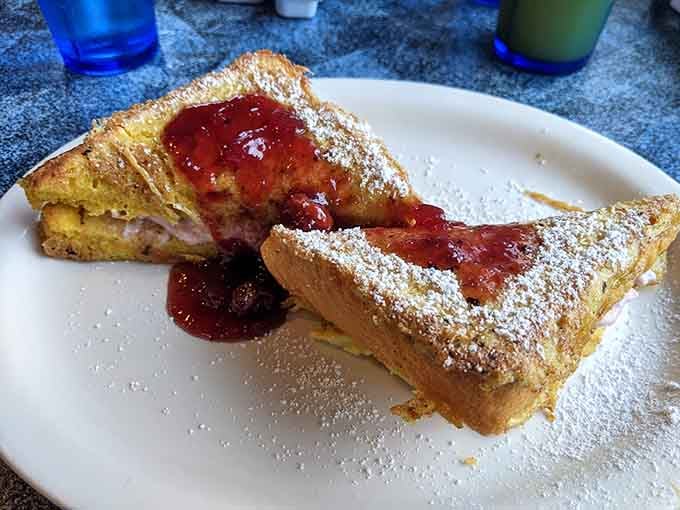 Golden French toast dusted with powdered sugar and topped with strawberry preserves tastes like Saturday morning should.