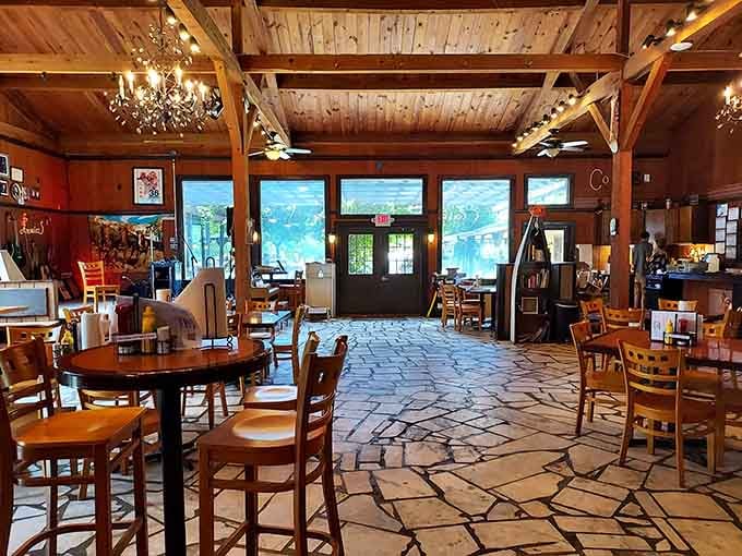 Warm wood, stone floors, and chandeliers that somehow work perfectly here. This dining room says "rustic" but means "seriously charming."