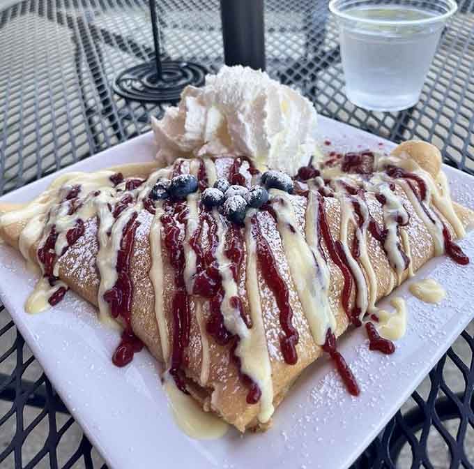 Drizzled with berry sauce, crowned with blueberries and whipped cream &mdash; the Patricie cr&ecirc;pe is basically a celebration on a plate.