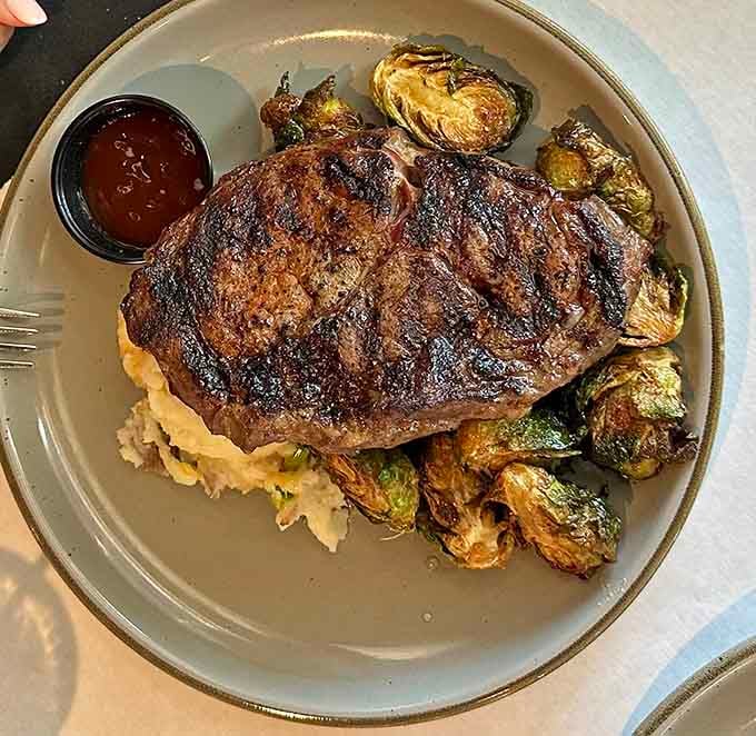 Ribeye, mashed potatoes, and roasted brussels sprouts form the holy trinity of satisfying dinner decisions tonight.