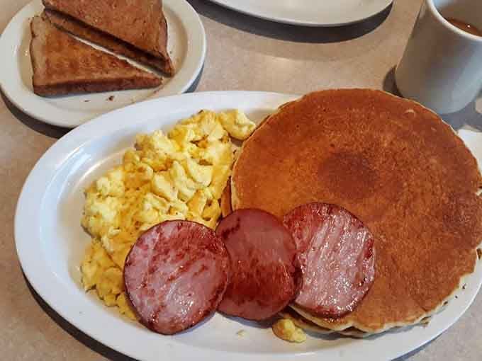 That fluffy buttermilk pancake alongside Polish sausage and scrambled eggs is basically a love letter to your taste buds.