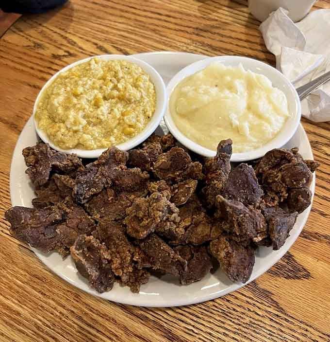 Fried chicken livers with corn pudding and mashed potatoes. Bold, unapologetic, and deeply satisfying in every single bite.