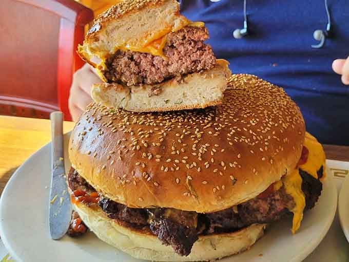 These patties are stacked like a delicious skyscraper. This burger isn't a meal, it's an architectural achievement.