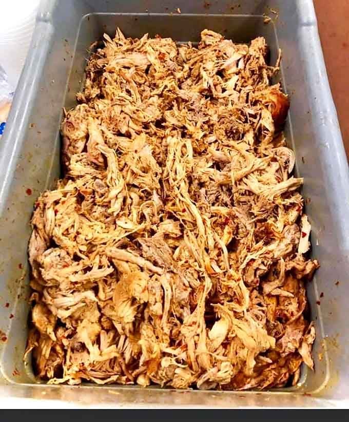 A full pan of pulled pork so perfectly shredded it looks like edible art from Williamsburg County.