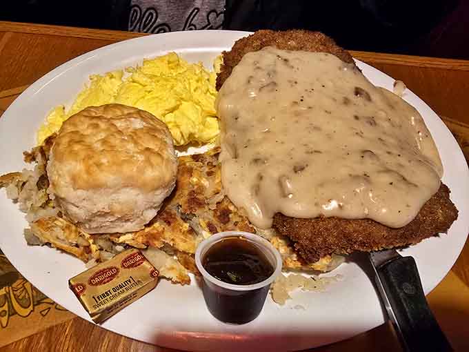 Hand-breaded chicken fried steak smothered in gravy, the kind of plate that makes silence feel appropriate.