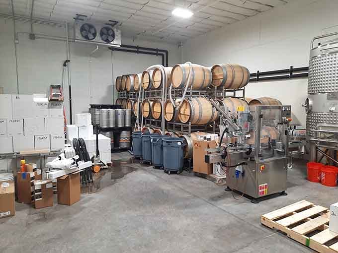 Oak barrels stacked and waiting, this is where patience and craftsmanship quietly turn Arizona grapes into something worth celebrating.