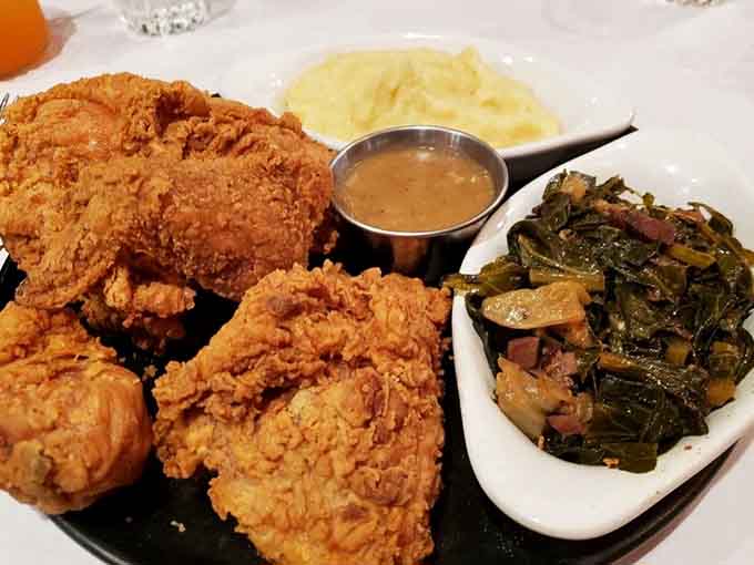 Fried chicken this beautiful, served with collard greens and mashed potatoes, is pure Southern comfort on a plate.