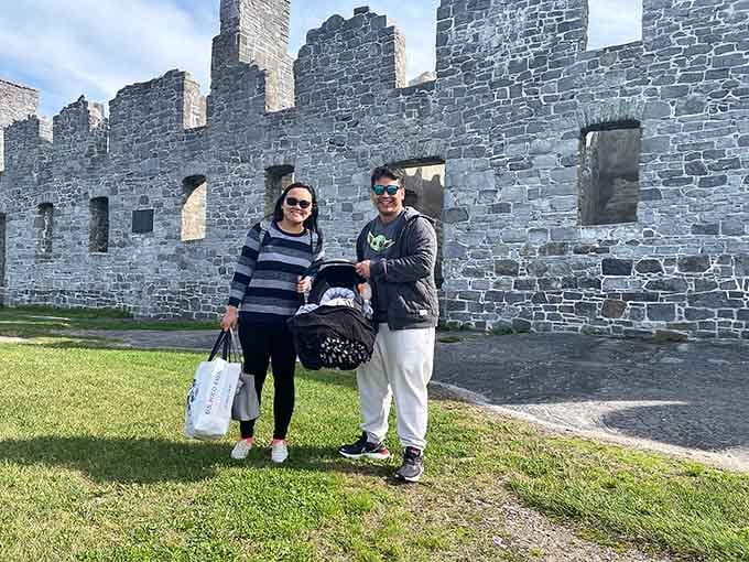 Happy visitors posing against walls that have seen more history than most textbooks could ever hope to cover.