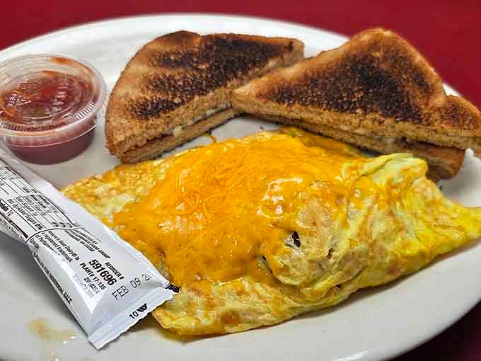 That melted cheddar omelette with toast and jam on the side is breakfast doing its very best work.