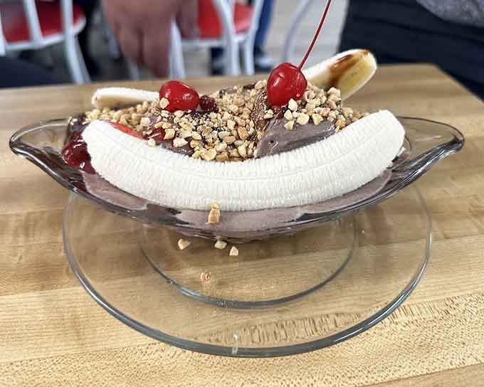 Two cherries, a whole banana, rich chocolate ice cream, and chopped nuts &mdash; this banana split isn't sharing with anyone.