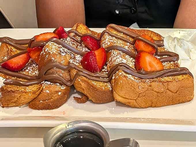 French toast drizzled with chocolate and topped with fresh strawberries. Breakfast just became a special occasion.