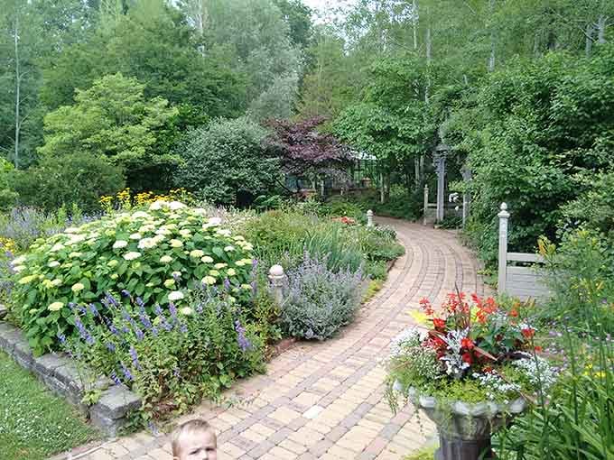 Hydrangeas, salvia, and a winding brick path. This garden doesn't do anything halfway.