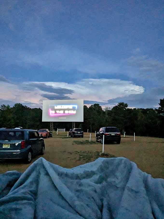 A cozy blanket, a glowing screen, and a sky full of clouds. This is living, folks.