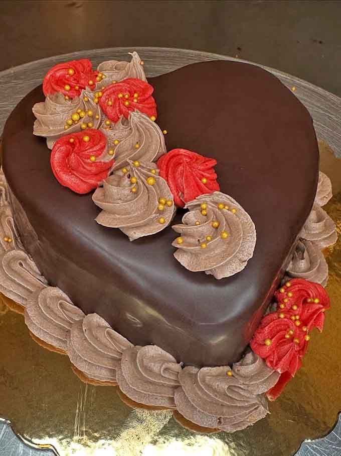 This heart-shaped chocolate beauty proves love and ganache make the world go round, one slice at a time.