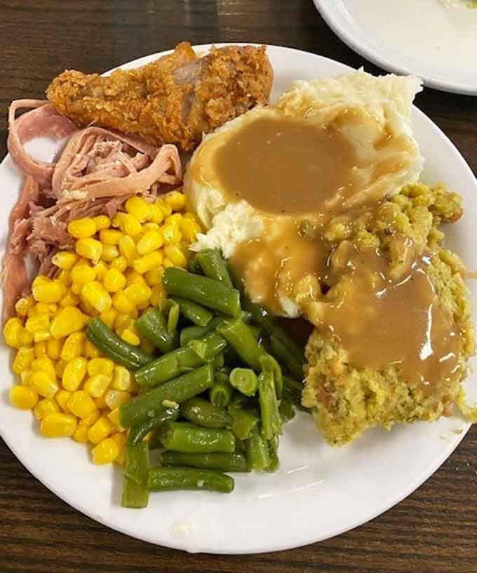 Fried chicken, pulled ham, mashed potatoes with gravy, corn, green beans, and stuffing, this plate came to win.