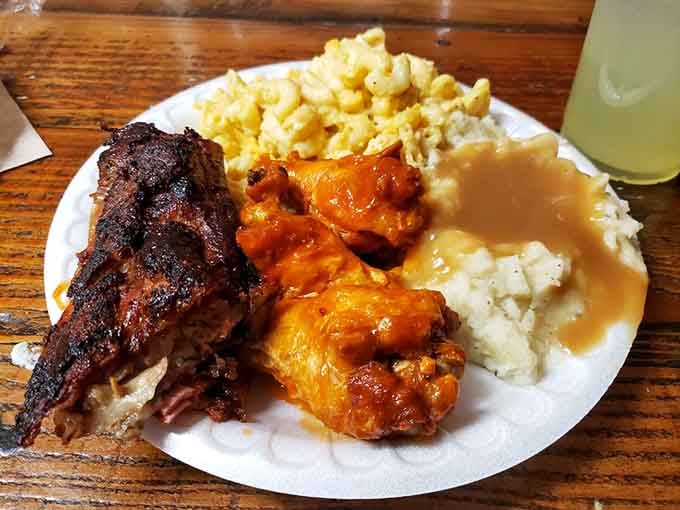 Buffalo wings, smoked ribs, mac and cheese, and mashed potatoes with gravy, this plate is pure, unapologetic joy.