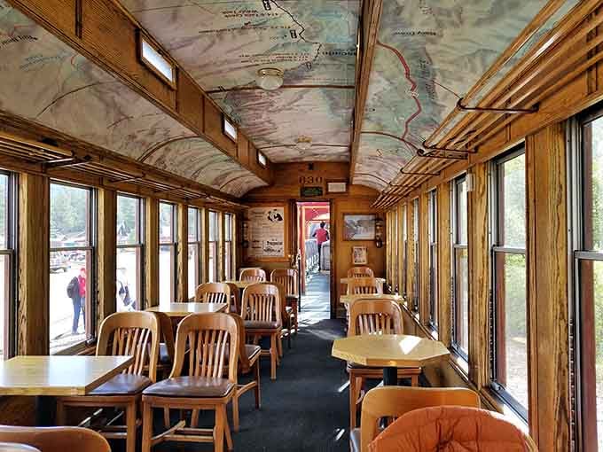 The dining car ceiling is practically a work of art, maps overhead and mountains outside the windows.