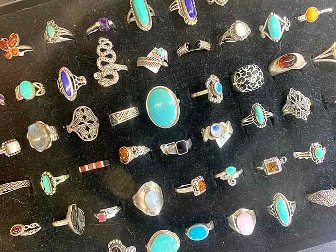 Rows of silver rings set with turquoise, amber, and opal, each one practically begging to come home with you.