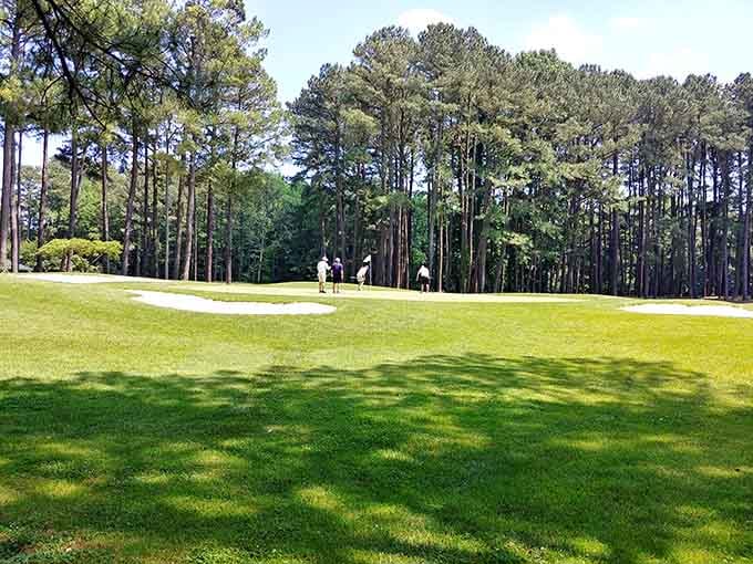 Perfectly manicured greens stretch beneath towering pines, offering golfers their own slice of Eastern Shore paradise.