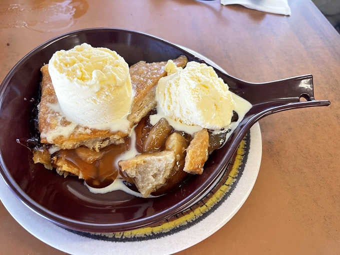 Apple cobbler with two scoops of vanilla ice cream. Dessert for breakfast is always the correct decision.
