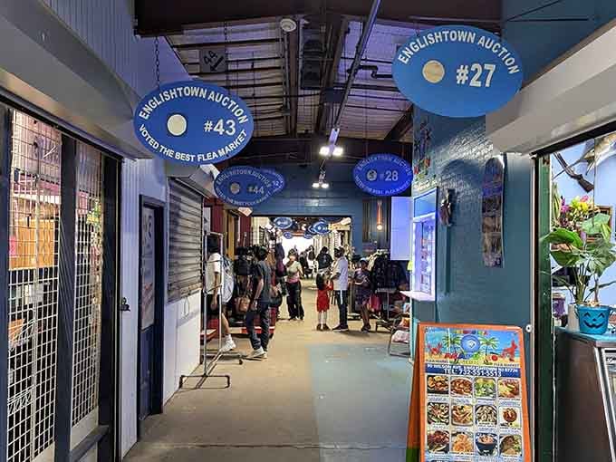 Blue ceiling signs guide you through numbered aisles where discovery awaits around every single corner.