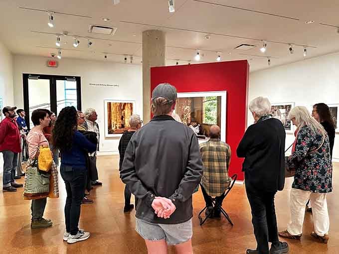 When a crowd gathers this quietly in front of artwork, you know something genuinely powerful is happening on that wall.