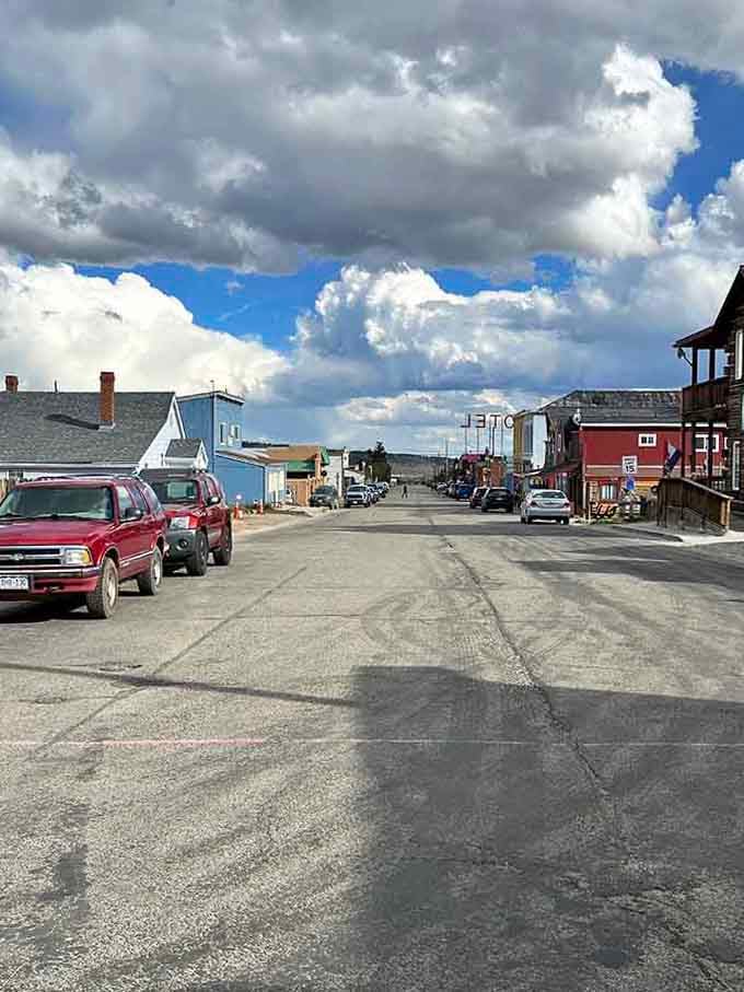 Front Street stretches toward distant peaks, where the pavement ends and the real Colorado begins.