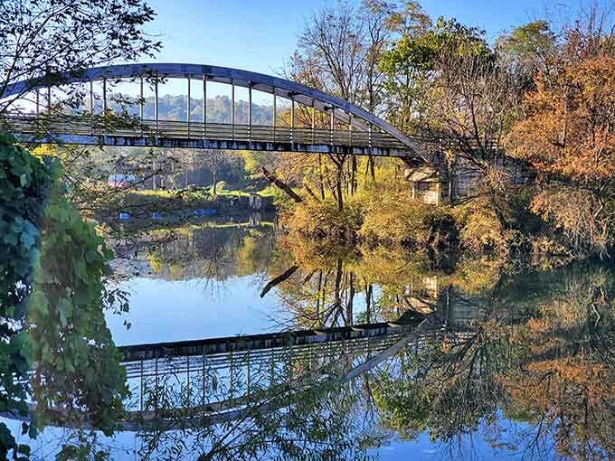 A bridge reflected perfectly in still water is nature's way of showing off its photography skills.