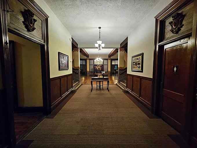 These hallways stretch into shadows that seem just a little too eager to swallow your flashlight beam whole.