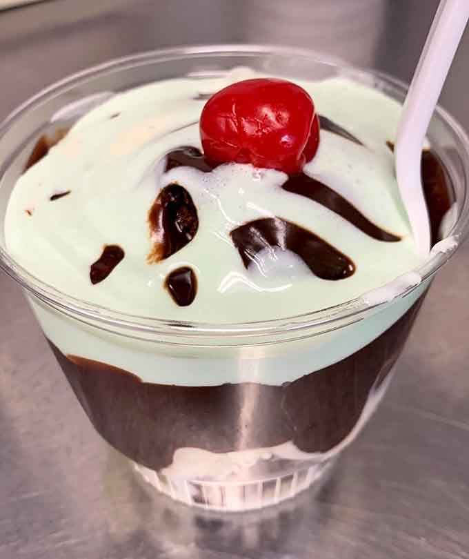 Layers of mint custard, hot fudge, and a cherry crown. This sundae means serious, delicious business.