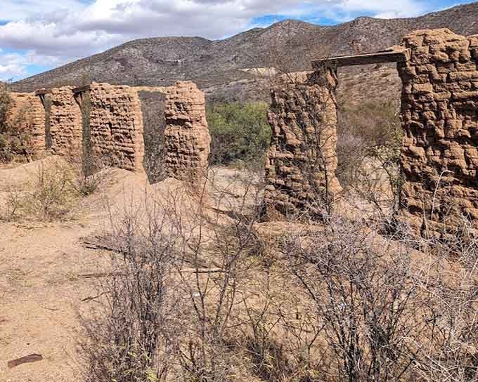 Adobe ruins stand like ancient sentinels, reminding us that even walls have expiration dates in the desert.